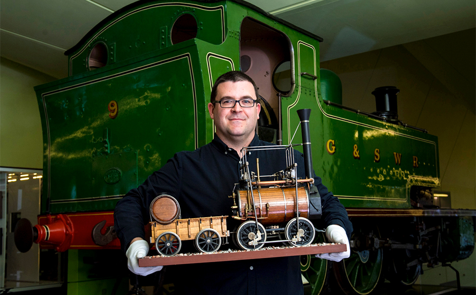 Curator John Messner looking at locomotives display at the Riverside ...